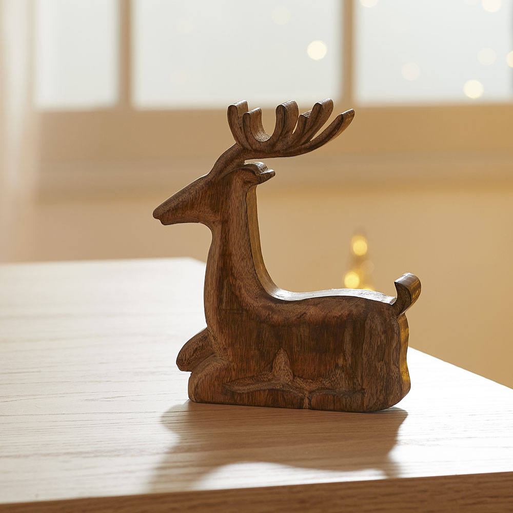 Carved Natural Sitting Timber Reindeer | Adairs