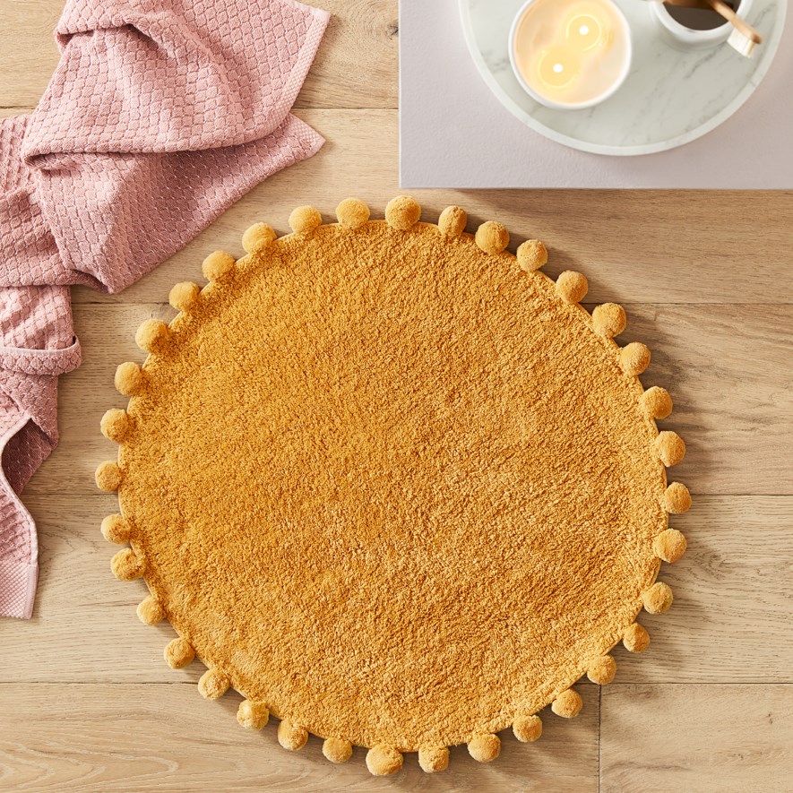 Livia Mustard Pom-Pom Circle Bath Mat | Adairs